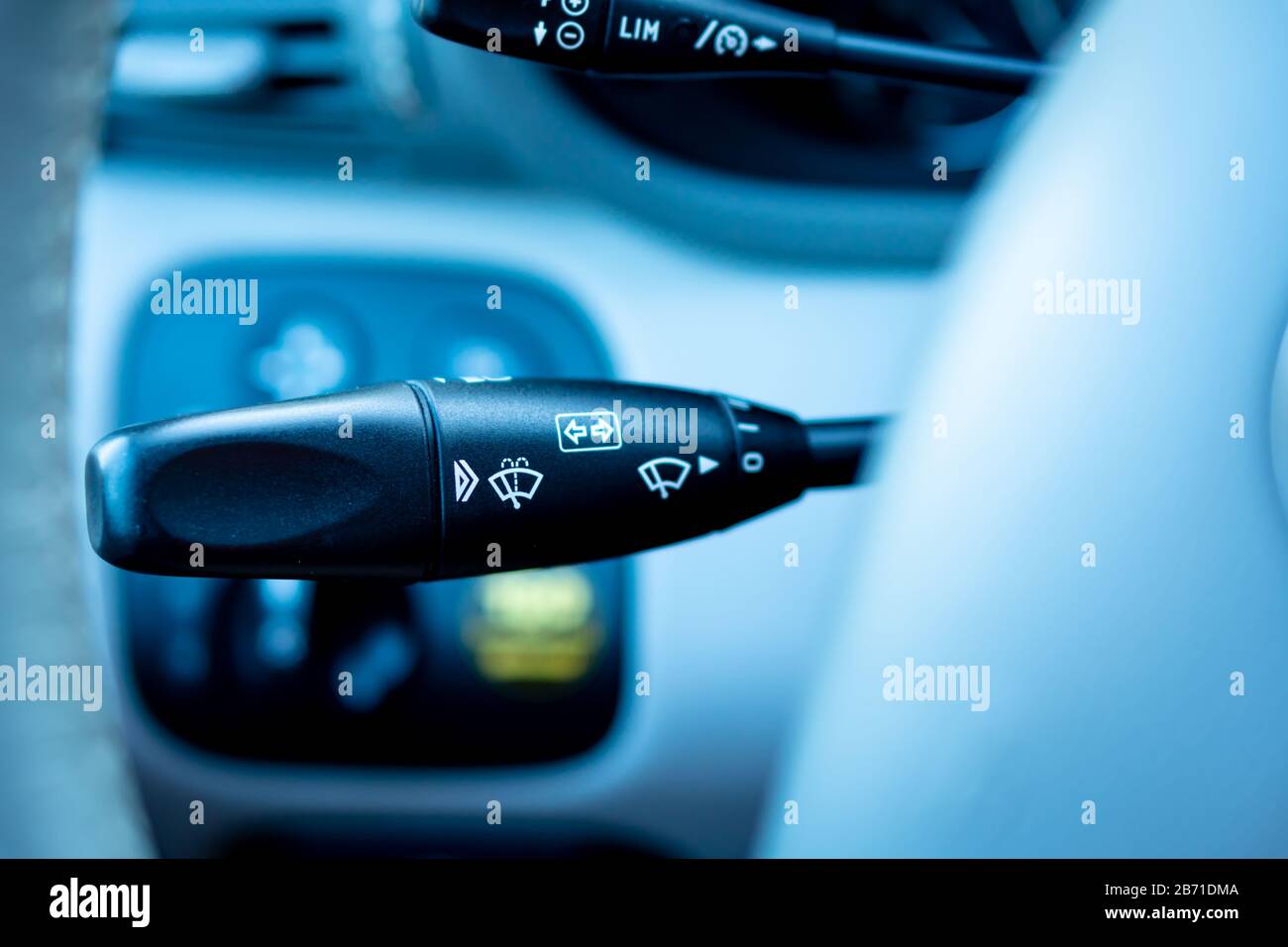 Close up automatic cruise control - tempomat command with blurred gages ...