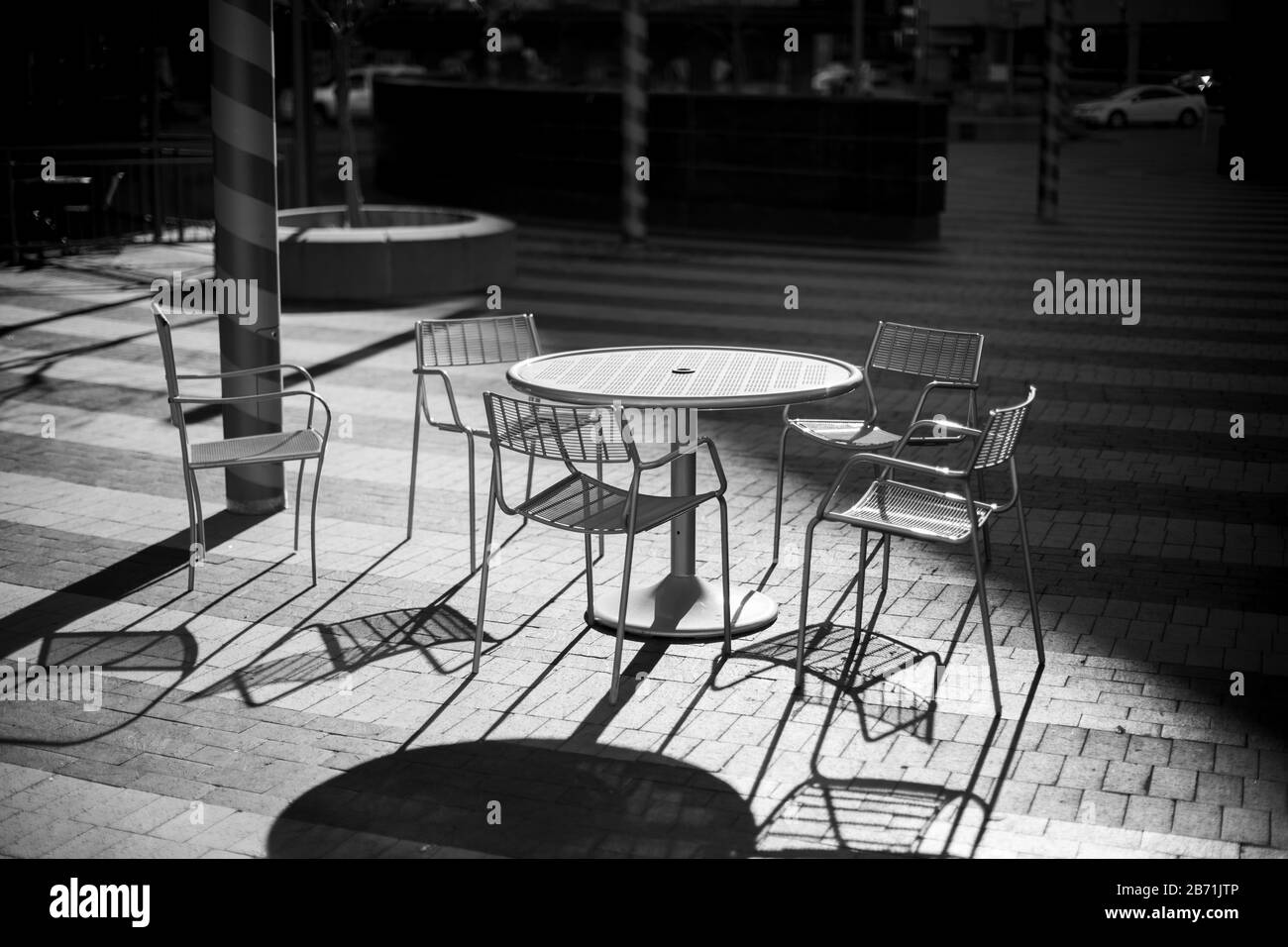 Outdoor furniture table chairs Black and White Stock Photos & Images ...
