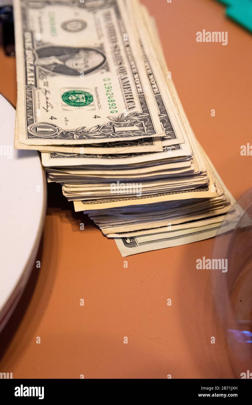 Small stack of US paper money Stock Photo - Alamy