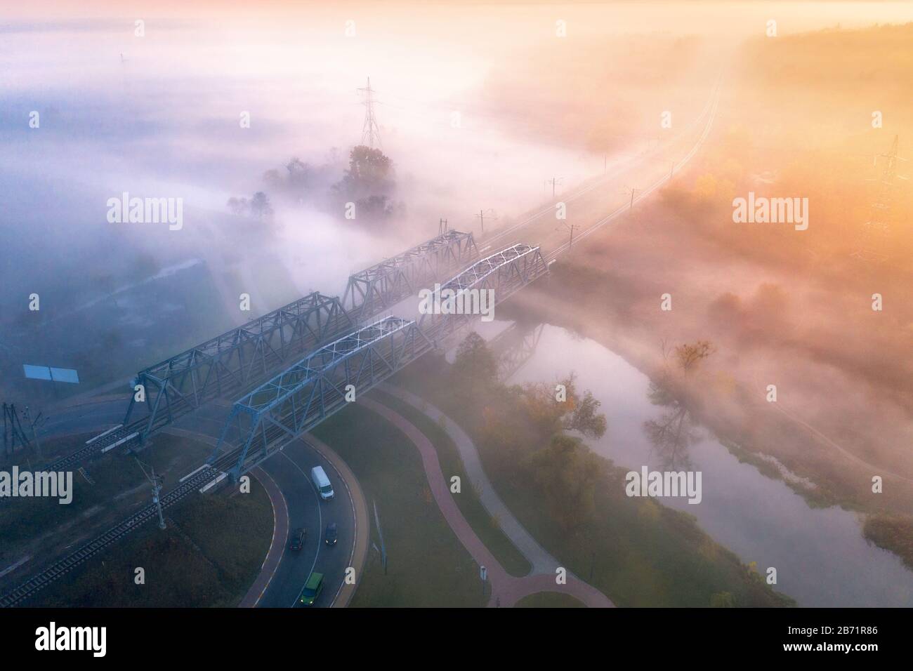 Aerial view of beautiful railroad bridge and river in fog in fall Stock ...
