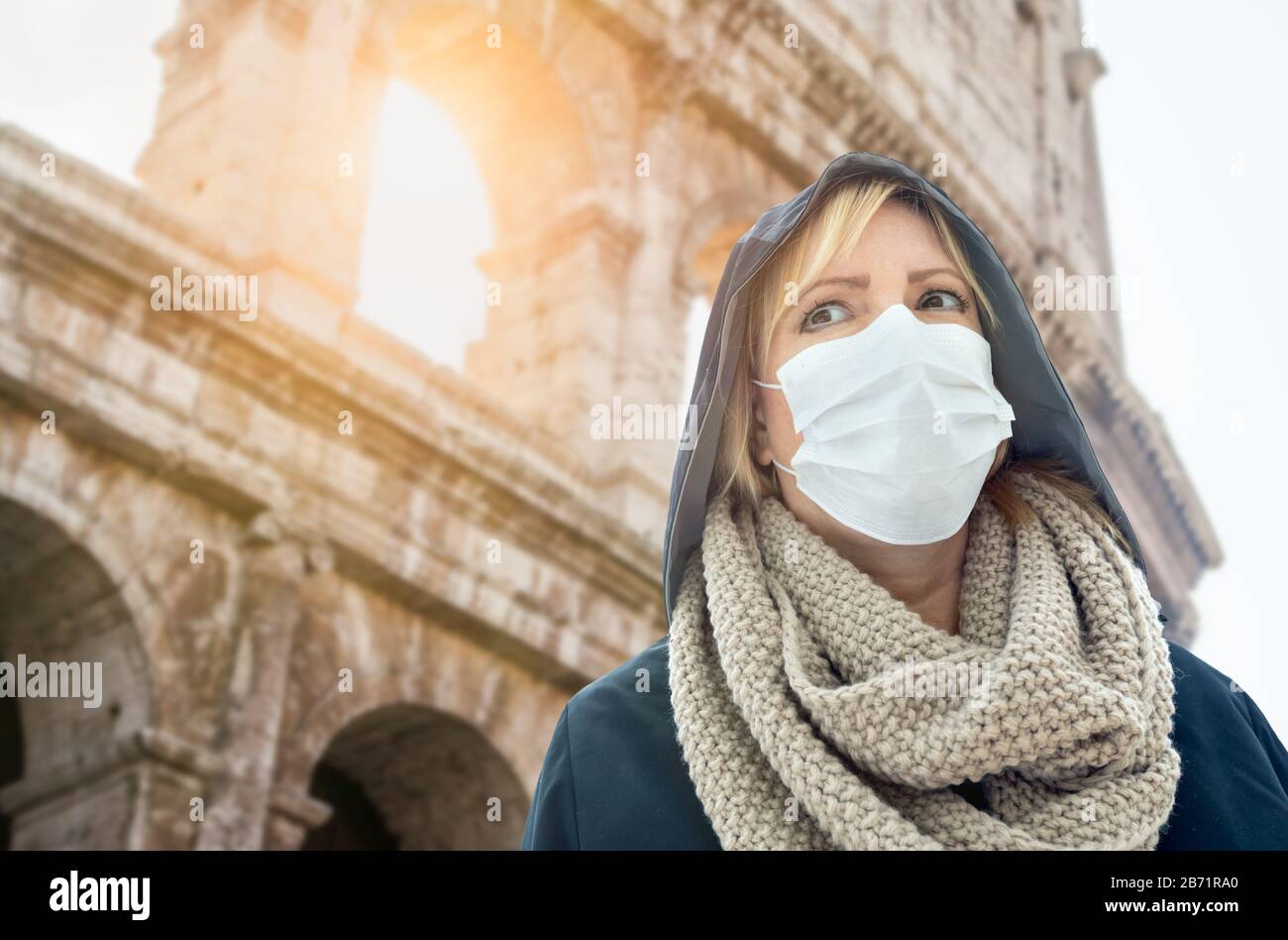 Young Woman Wearing Face Mask Walks Near the The Roman Coliseum In Rome ...