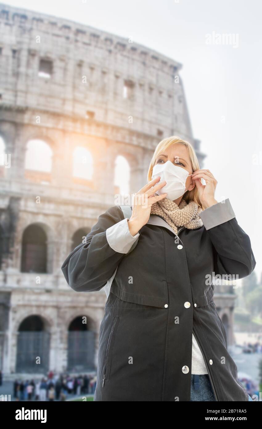 Young Woman Wearing Face Mask Walks Near the The Roman Coliseum In Rome ...