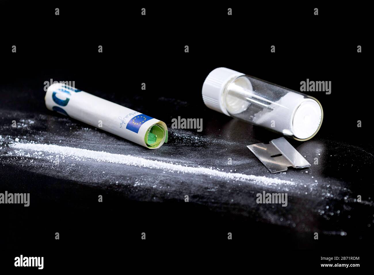 Cocaine Line and Razor Blade on a Black Background Stock Photo - Alamy