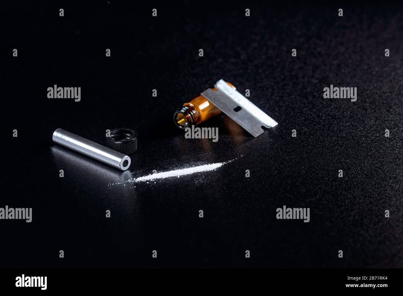 Cocaine Line and Razor Blade on a Black Background Stock Photo - Alamy