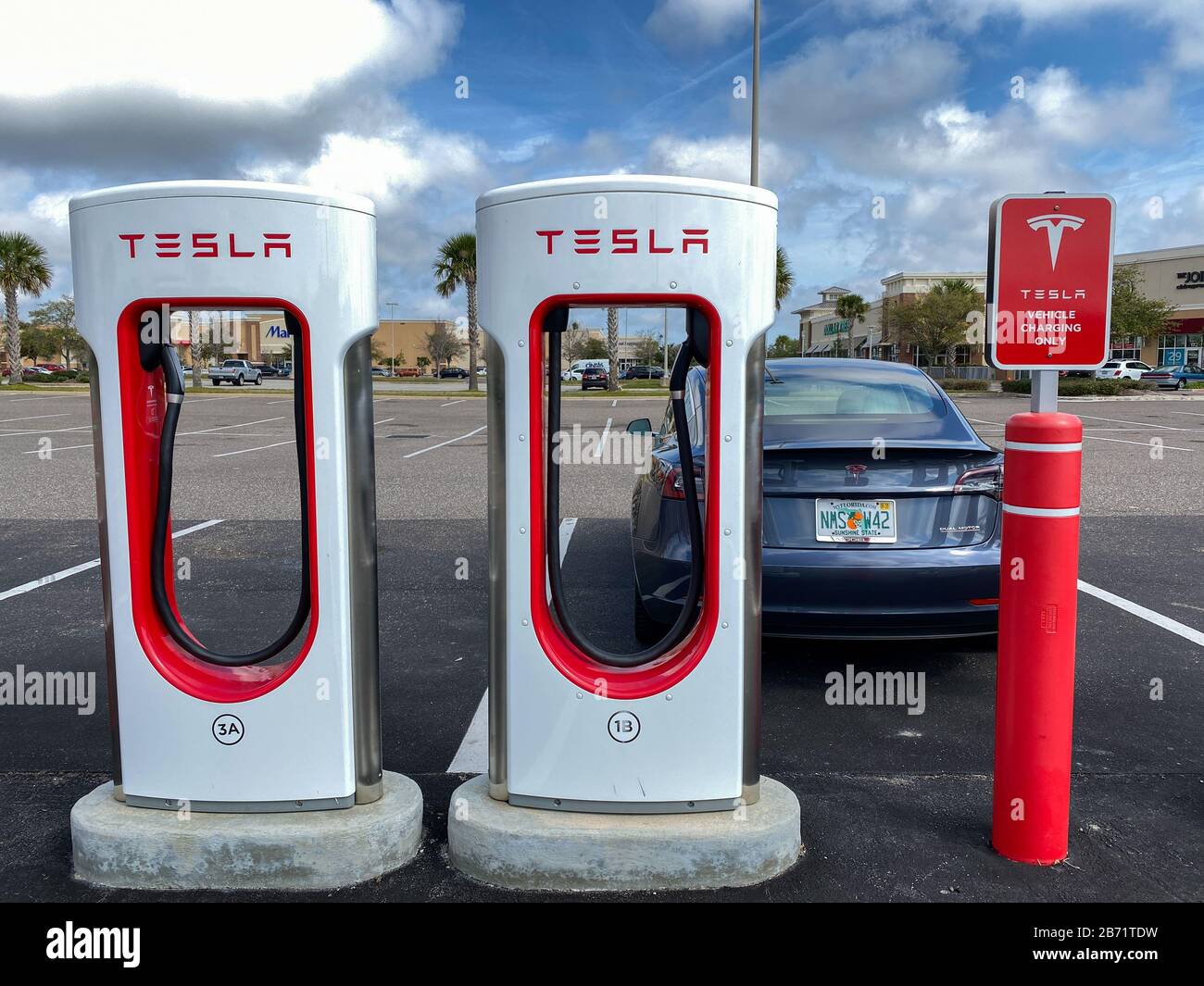 Melbourne, FL/USA-3/4/20: Cars charging at a Tesla Supercharger Station ...