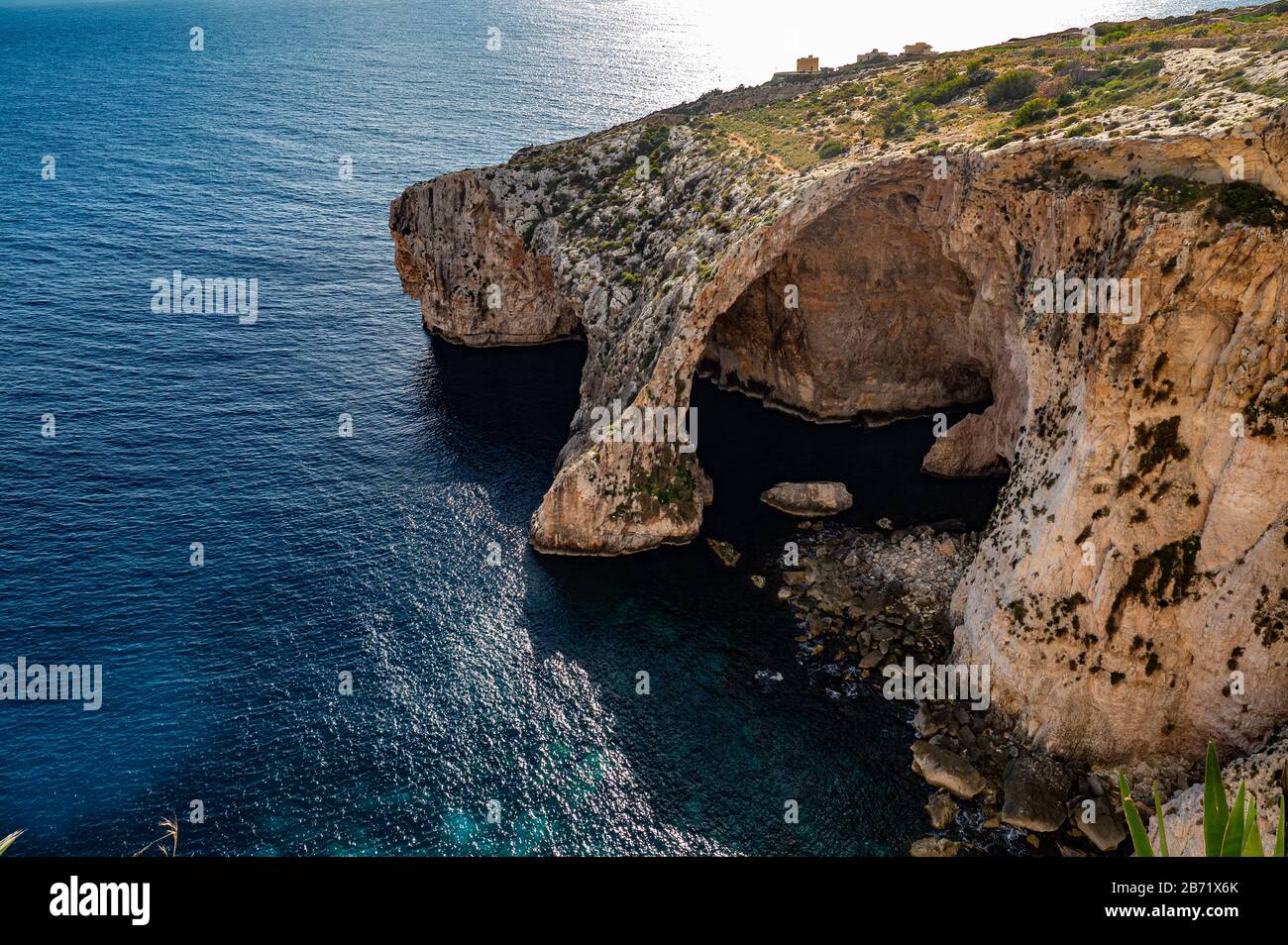 Amazing blue water at Blue Grotto on Malta Stock Photo - Alamy