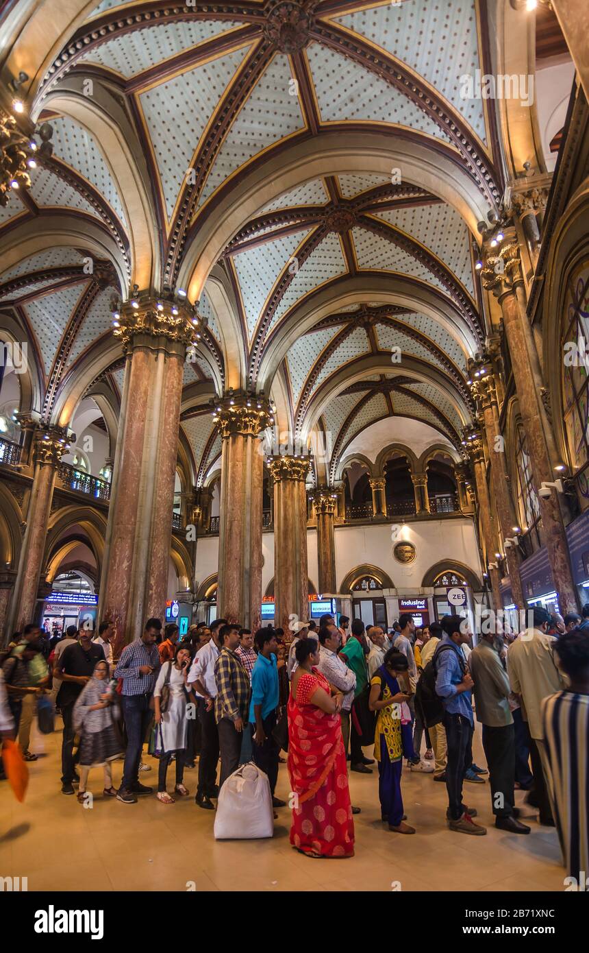 MUMBAI, INDIA – DEC. 19, 2019 : Passengers in queue at ticket windows ...
