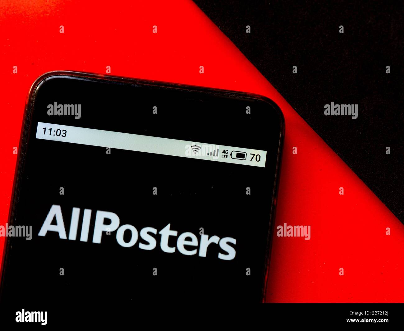In this photo illustration the AllPosters logo is seen displayed on a ...
