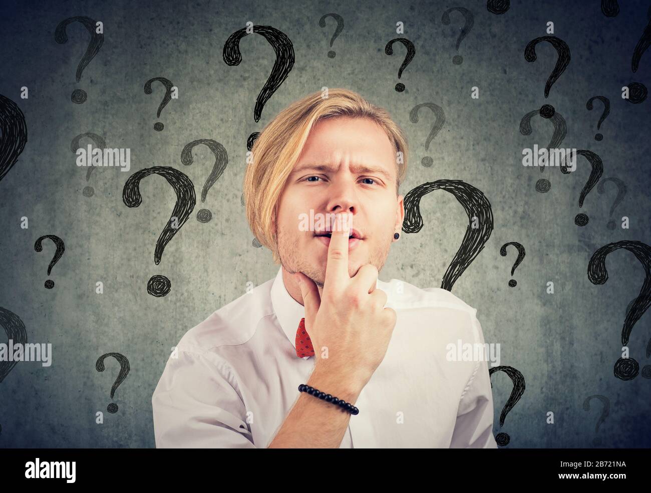 Confused young man with too many questions and no answer Stock Photo ...