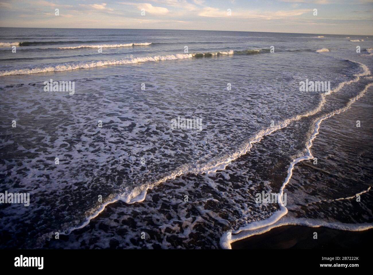 South Texas: Small waves lap at the shore on an undeveloped area at the ...