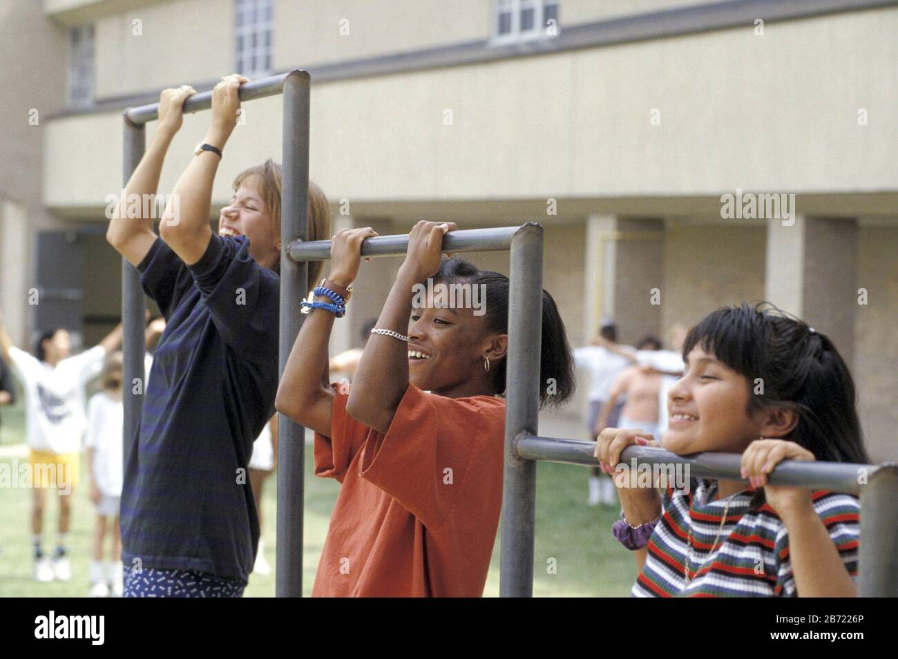 Austin Texas USA: Junior high girls do pull-ups on chin-up bars on ...
