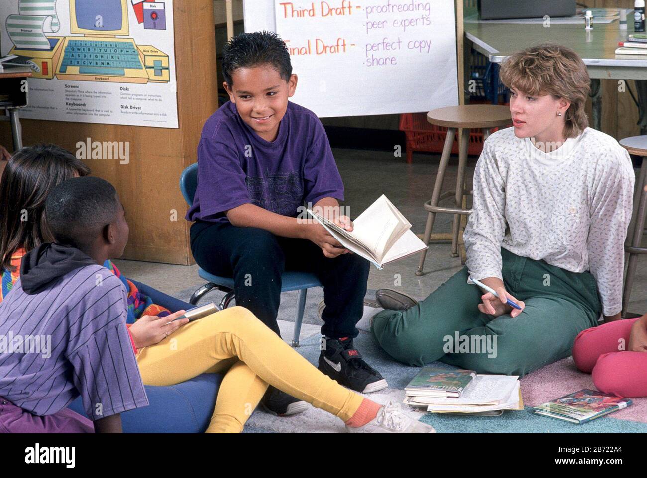 Austin Texas USA: Fifth grade students and teacher discussing books in ...