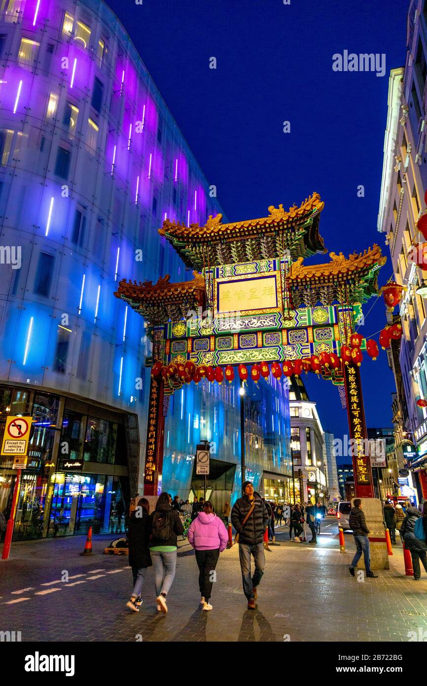 Colourful oriental style gate into Chinatown at night, London, UK Stock ...
