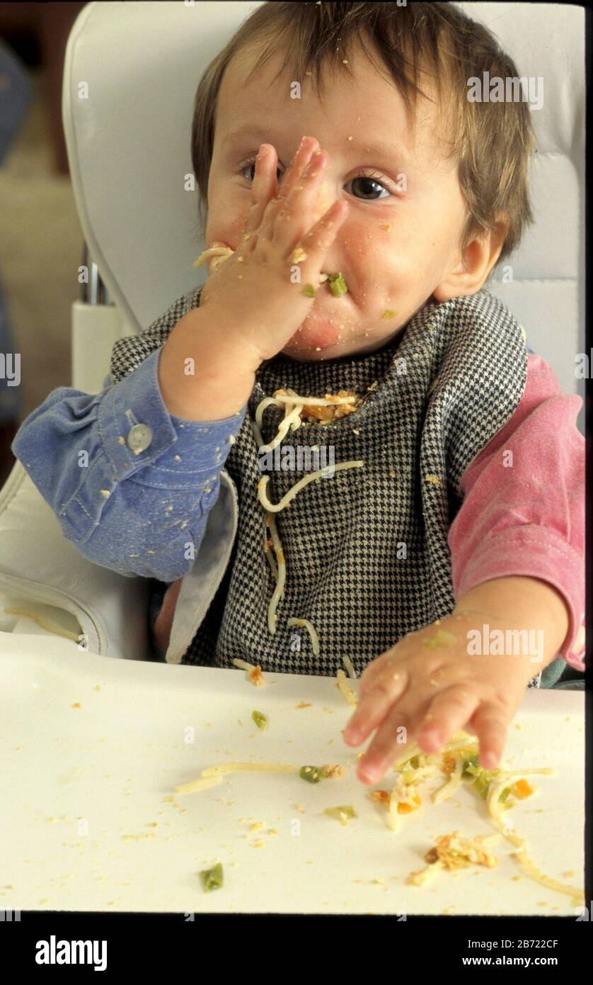 Messy baby boy eating spaghetti hi-res stock photography and images - Alamy