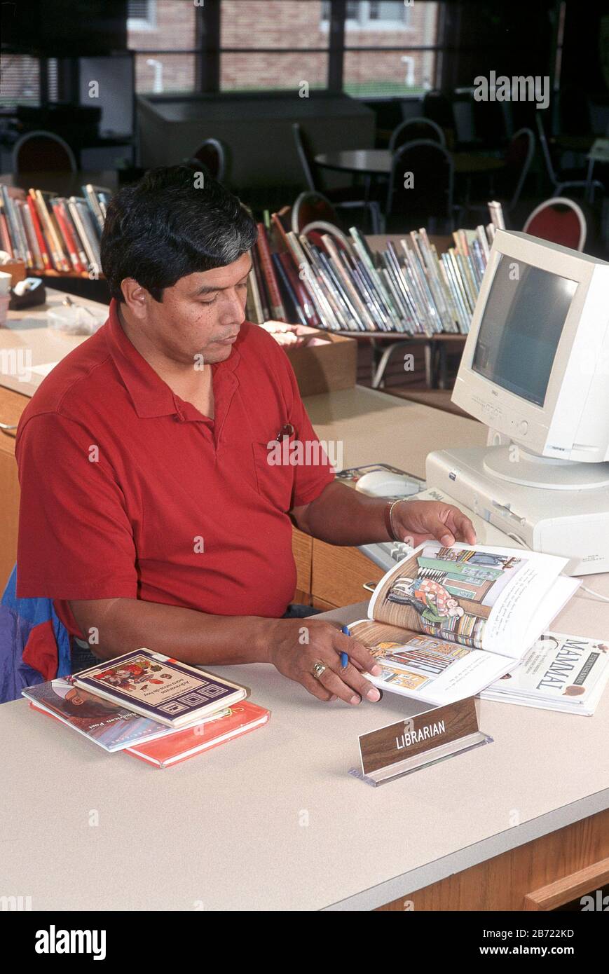 Male librarian desk hi-res stock photography and images - Alamy