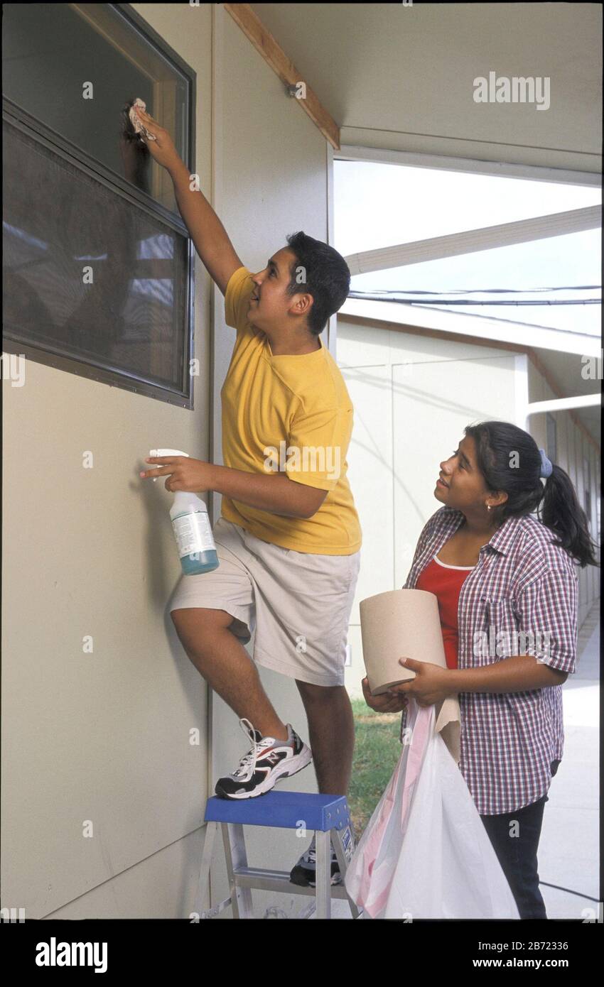 Teens doing chores together hi-res stock photography and images - Alamy
