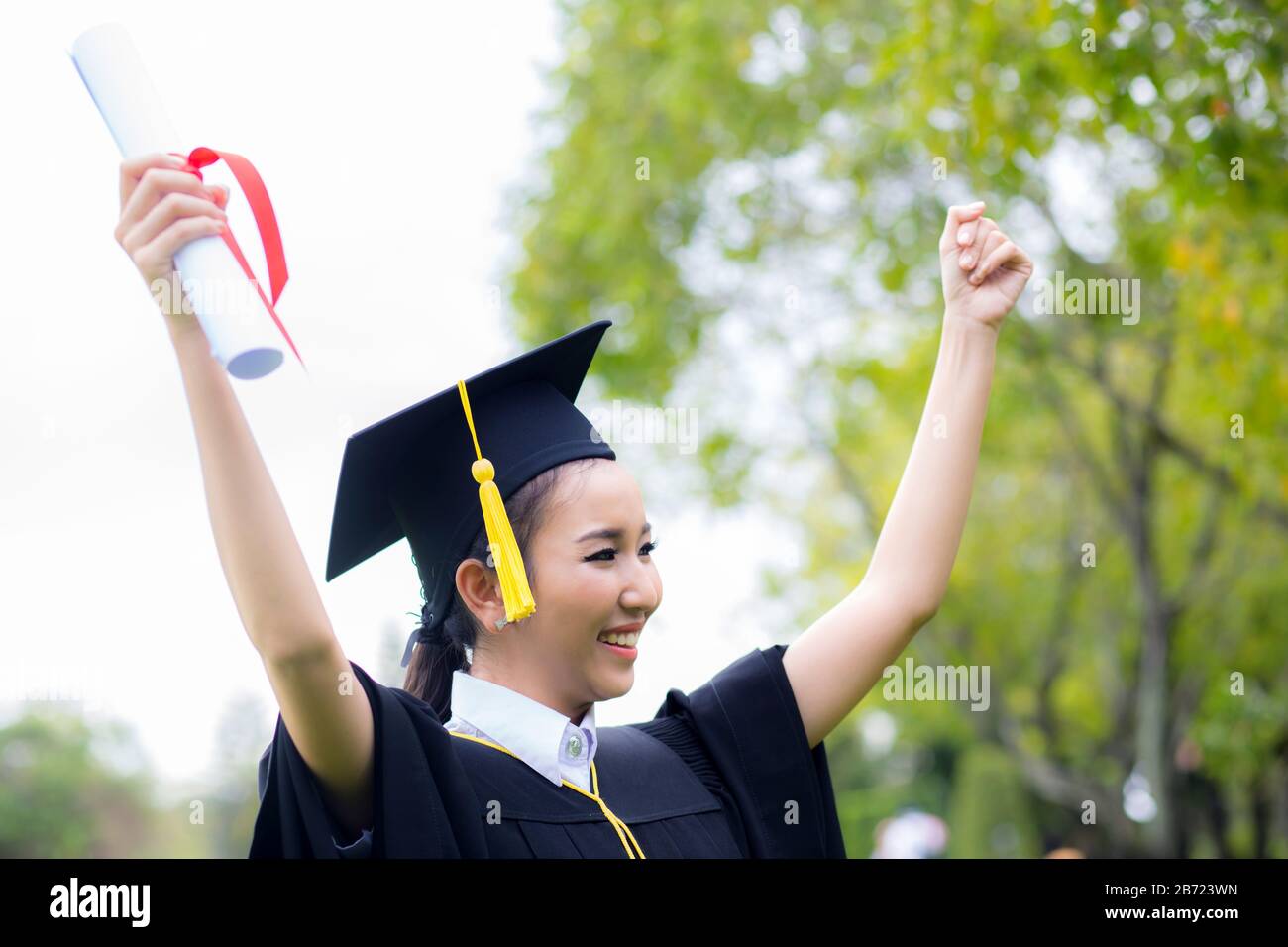 successful graduating student with nature background, Happy graduated ...