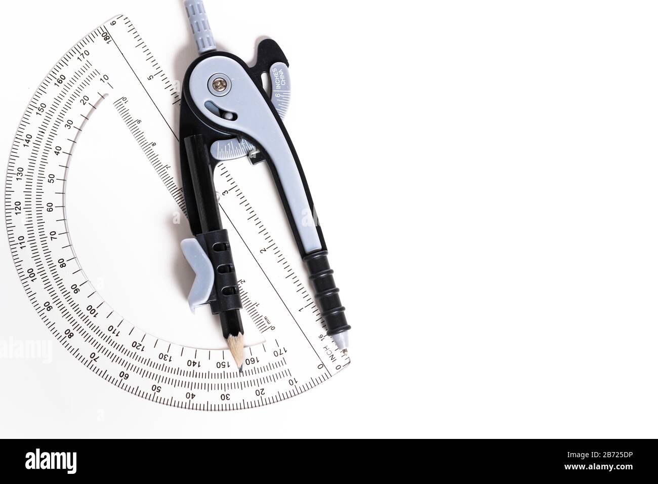 Compass and protractor on a white background Stock Photo - Alamy