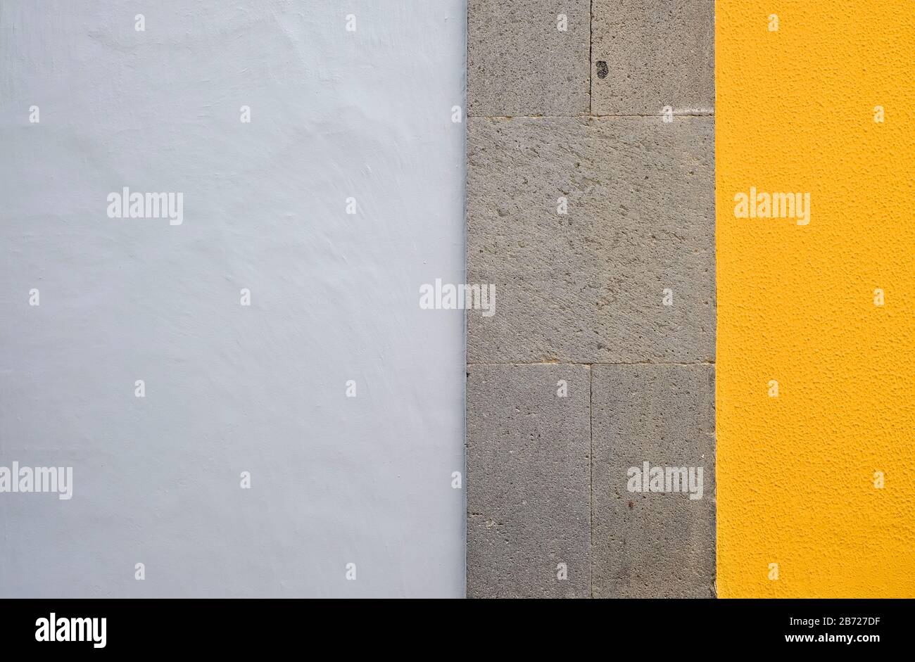 Wall panels in colors: yellow and gray, detail of modern house facade ...