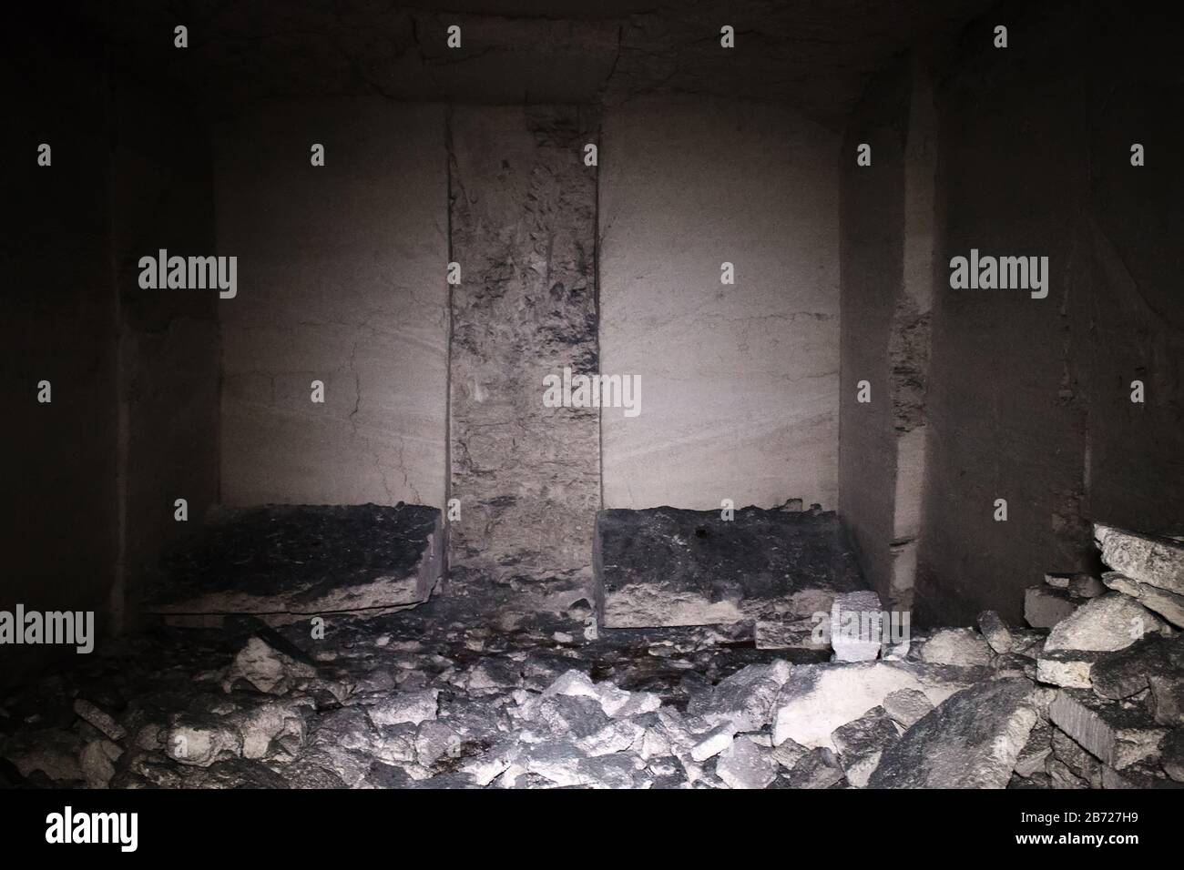 Old underground passage, dungeon, catacombs lined with stones and slabs ...