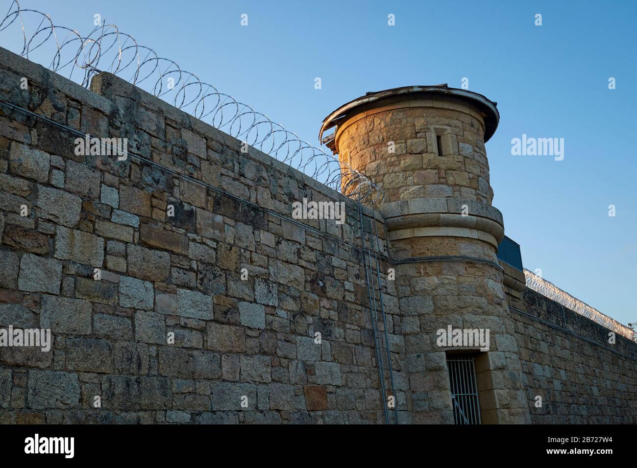 The stone wall with round watchtower at the old Gaol (jail). In ...