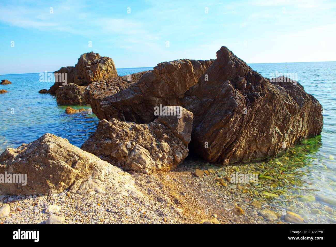 big natural rocks in the sea water Stock Photo - Alamy