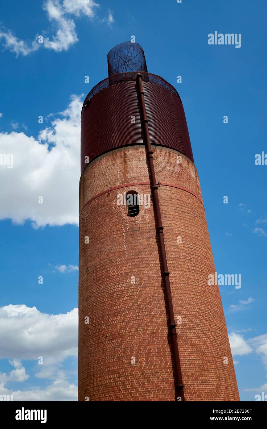 A former red brick, round water tower, now turned into a giant wine ...