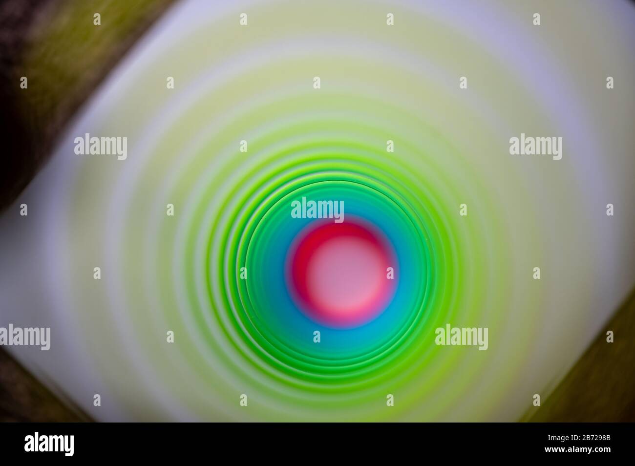 Looking inside colorful flexible bouncy plastic spring Stock Photo - Alamy