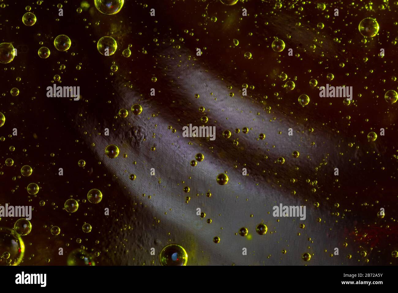 Macro photo of water bubbles suspended in oil Stock Photo - Alamy