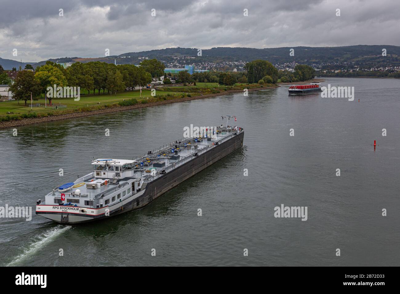 top view from a bridge across the river rhine onto a tank vessel with a ...