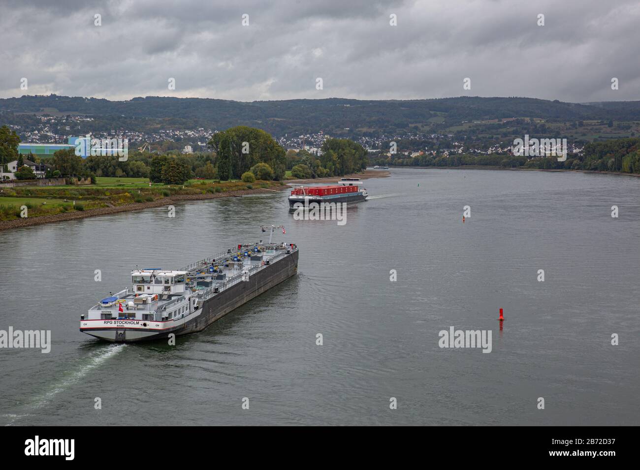 top view from a bridge across the river rhine onto a tank vessel with a ...