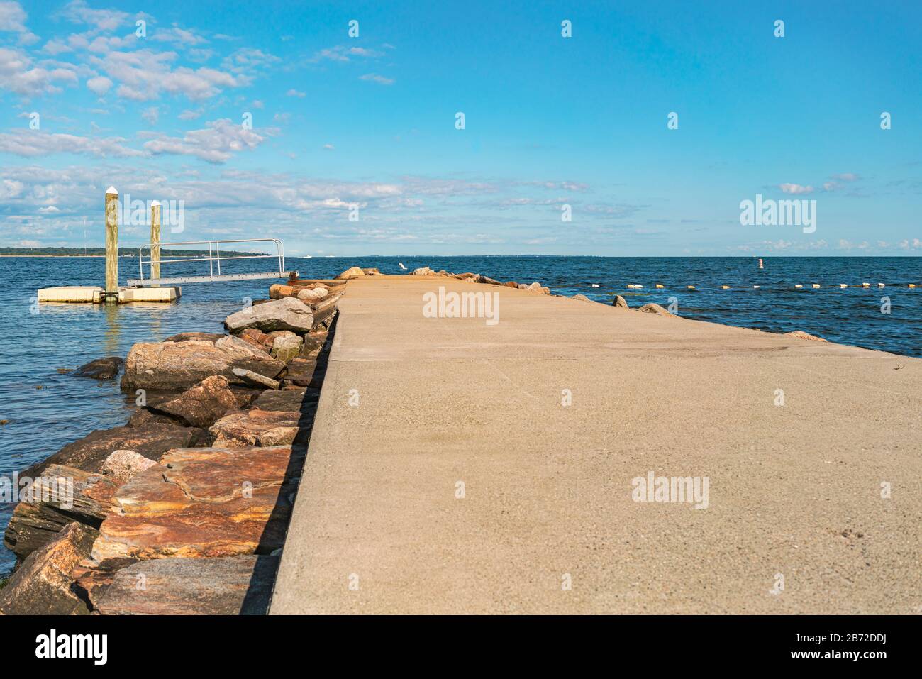 Empty pier on beach, beautiful sea, blue sky. Strong graphic background ...