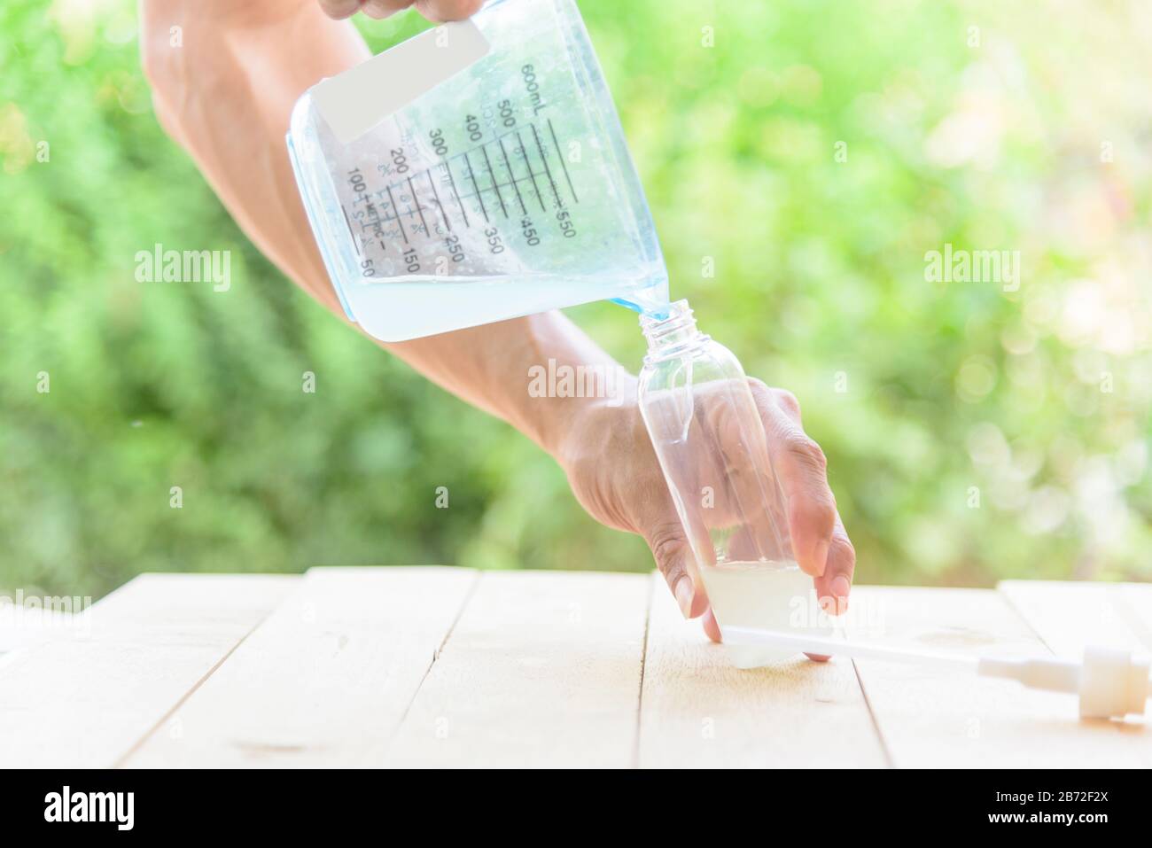 drain the water to bottle by syring Stock Photo - Alamy