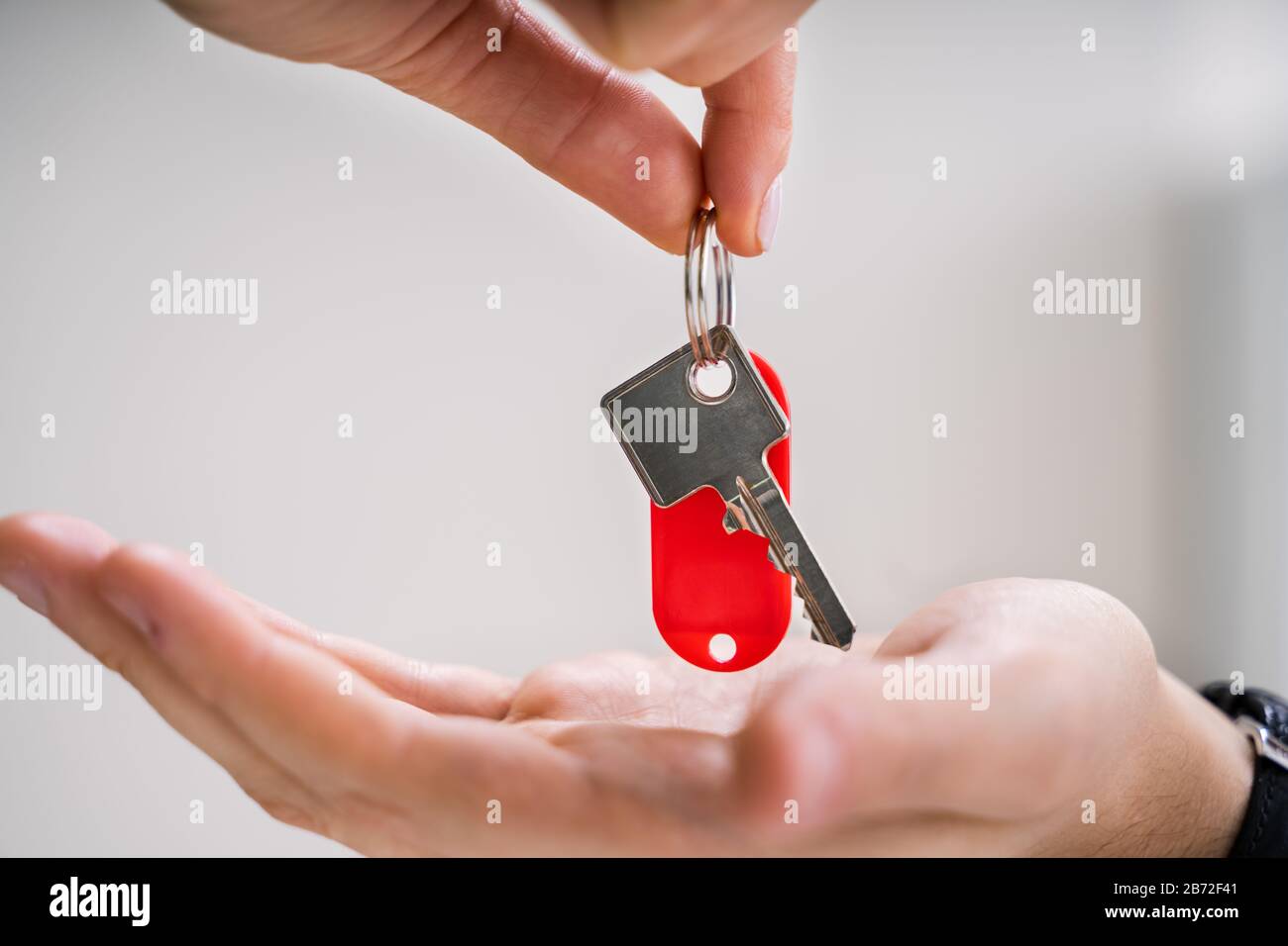 Man passing woman house keys hi-res stock photography and images - Alamy