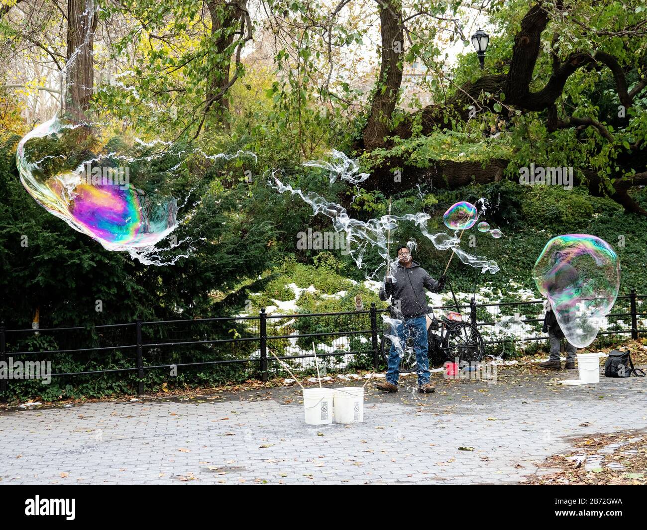 Bubble-maker and Bursting Bubble, Central Park, NYC Stock Photo - Alamy