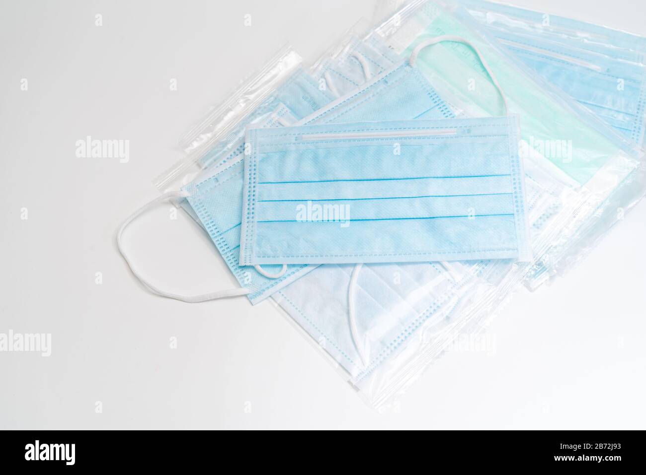 Surgical mask with rubber ear straps. Typical 3-ply surgical mask to ...