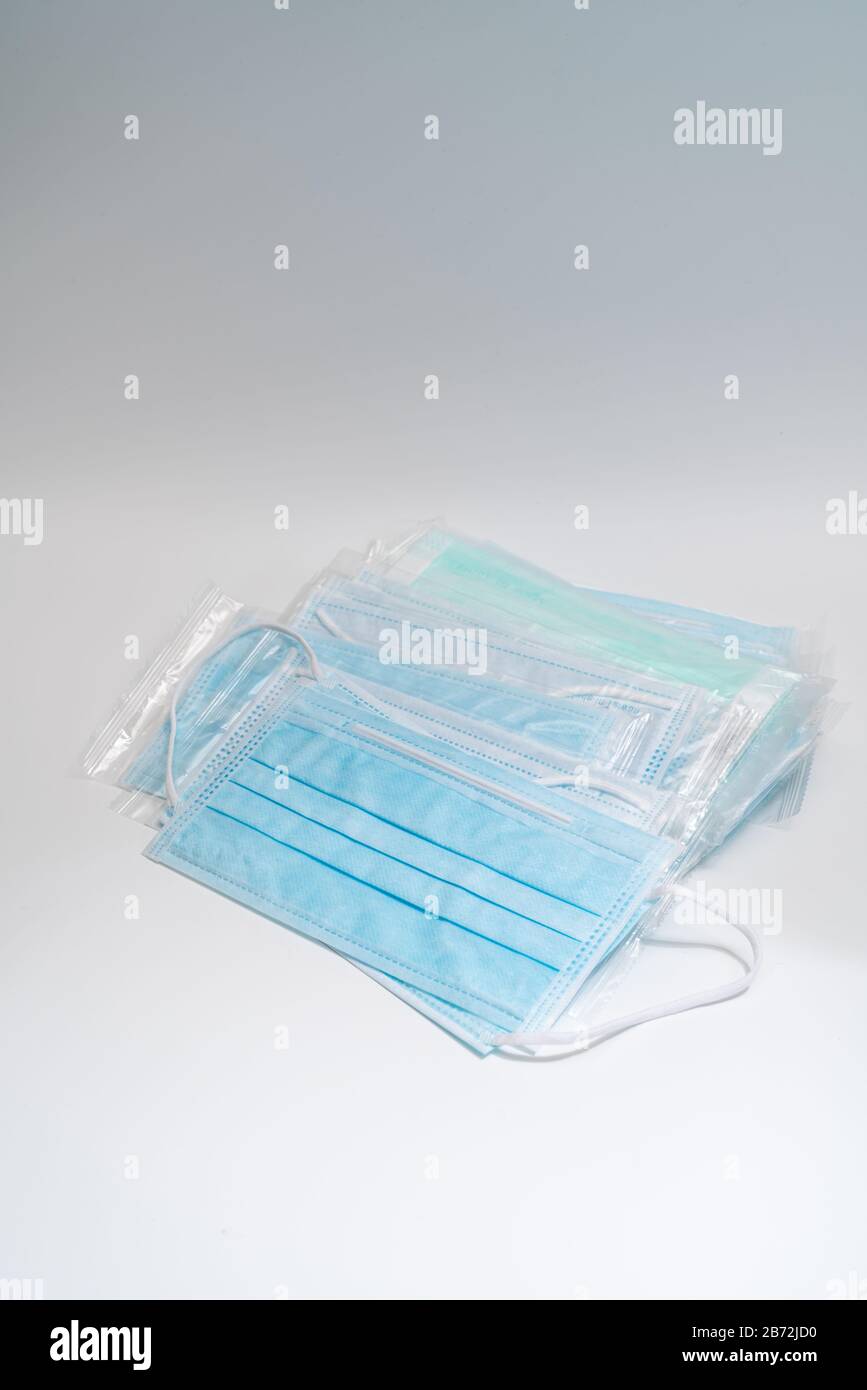 Surgical mask with rubber ear straps. Typical 3-ply surgical mask to ...