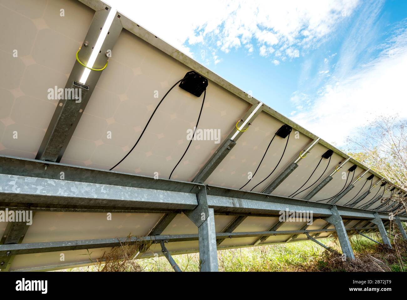 back side view photovoltaics in solar power station - copy space Stock ...