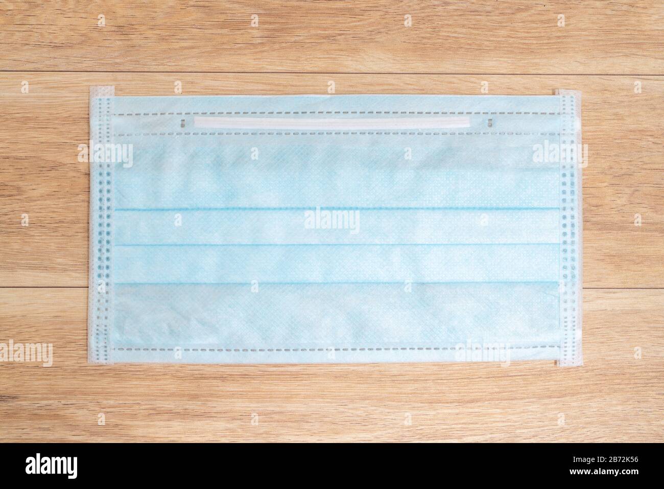 Surgical mask with rubber ear straps. Typical 3-ply surgical mask to ...