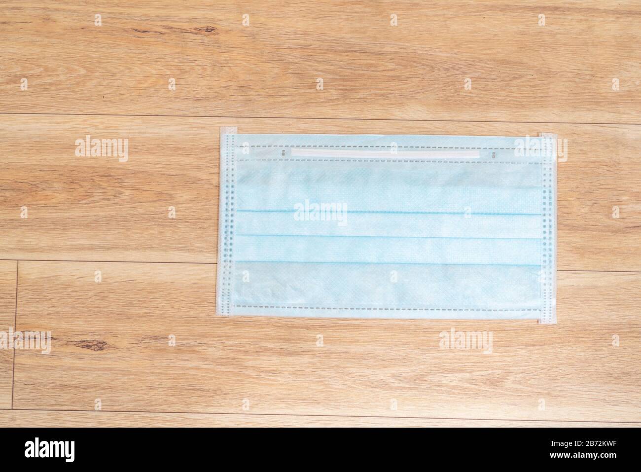 Surgical mask with rubber ear straps. Typical 3-ply surgical mask to ...