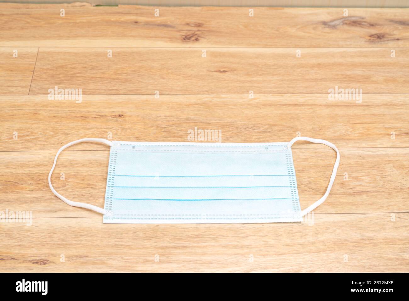 Surgical mask with rubber ear straps. Typical 3-ply surgical mask to ...