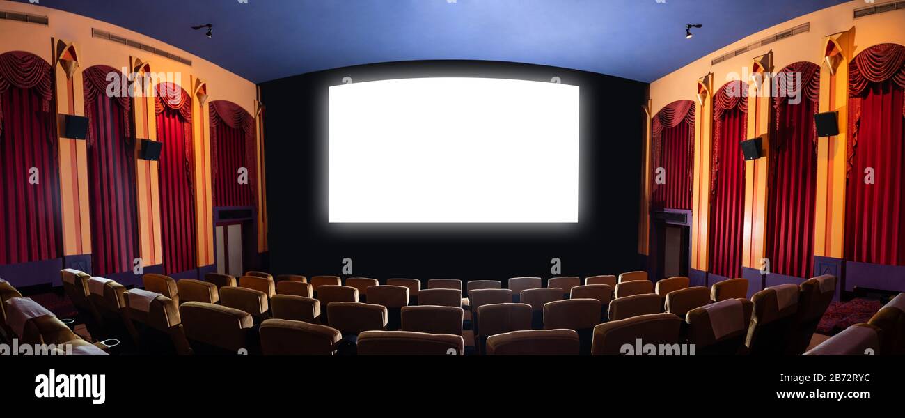Cinema theater screen in front of seat rows in movie theater showing ...