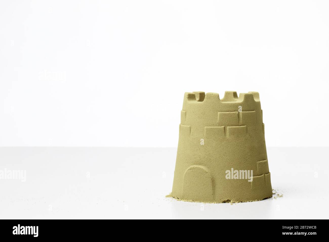 single small sand castle shot in the studio on a white background Stock ...