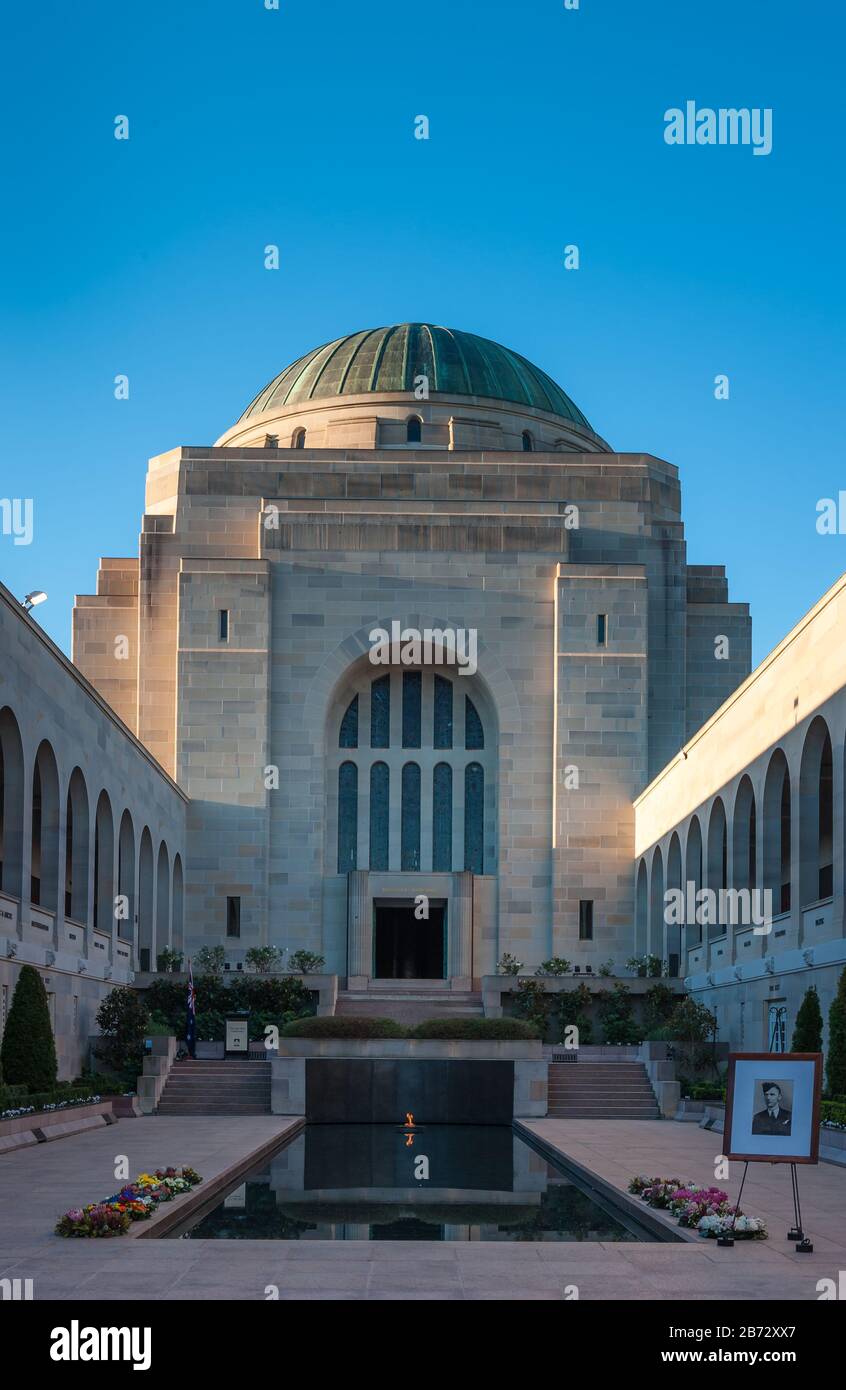 View of courtyard pool, ceremonial wreaths and framed soldiers portrait ...
