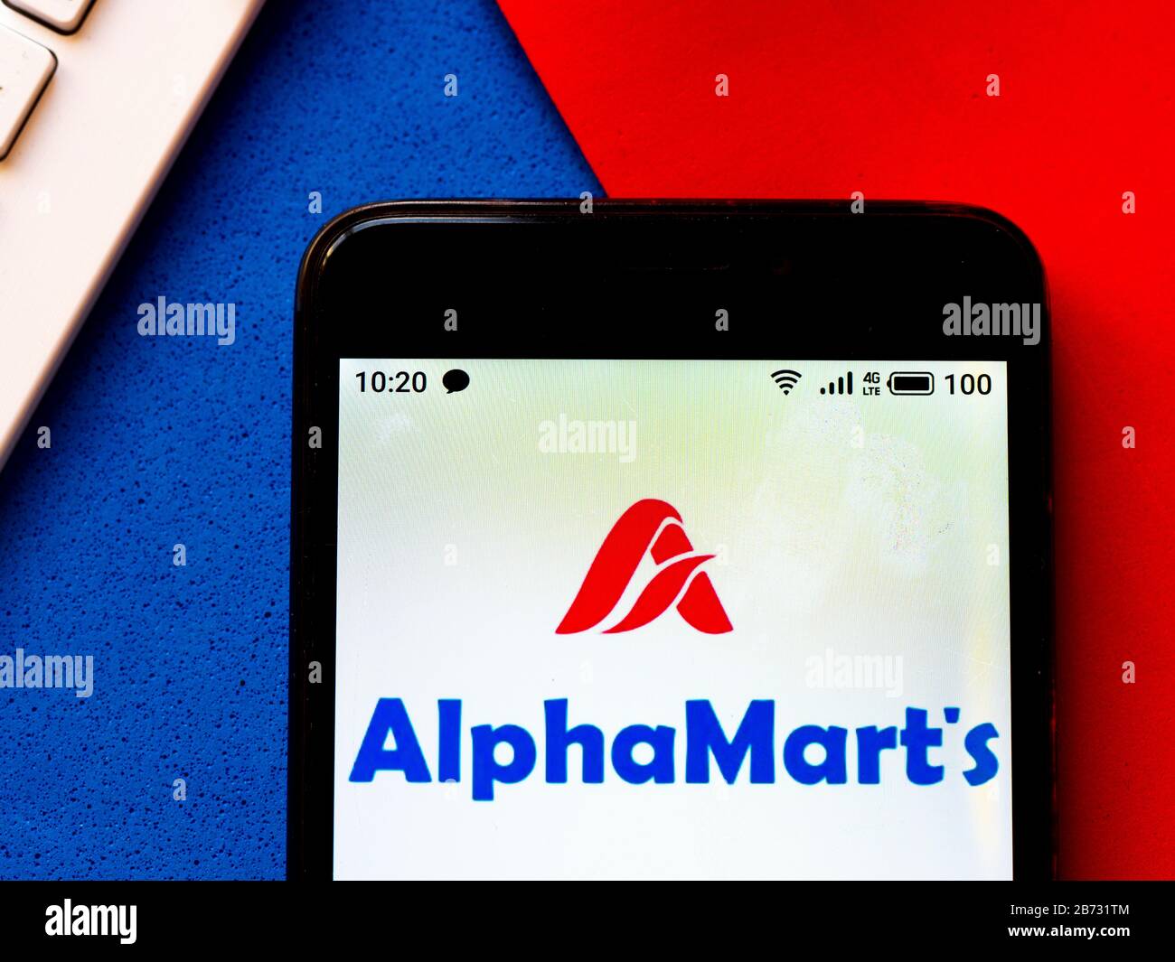 In this photo illustration the AlphaMart’s logo is seen displayed on a ...