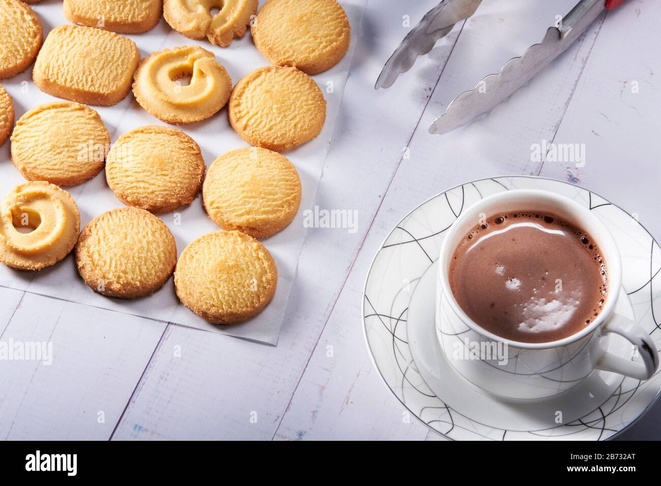 Afternoon tea with a pile of cookies and hot milk tea Stock Photo - Alamy