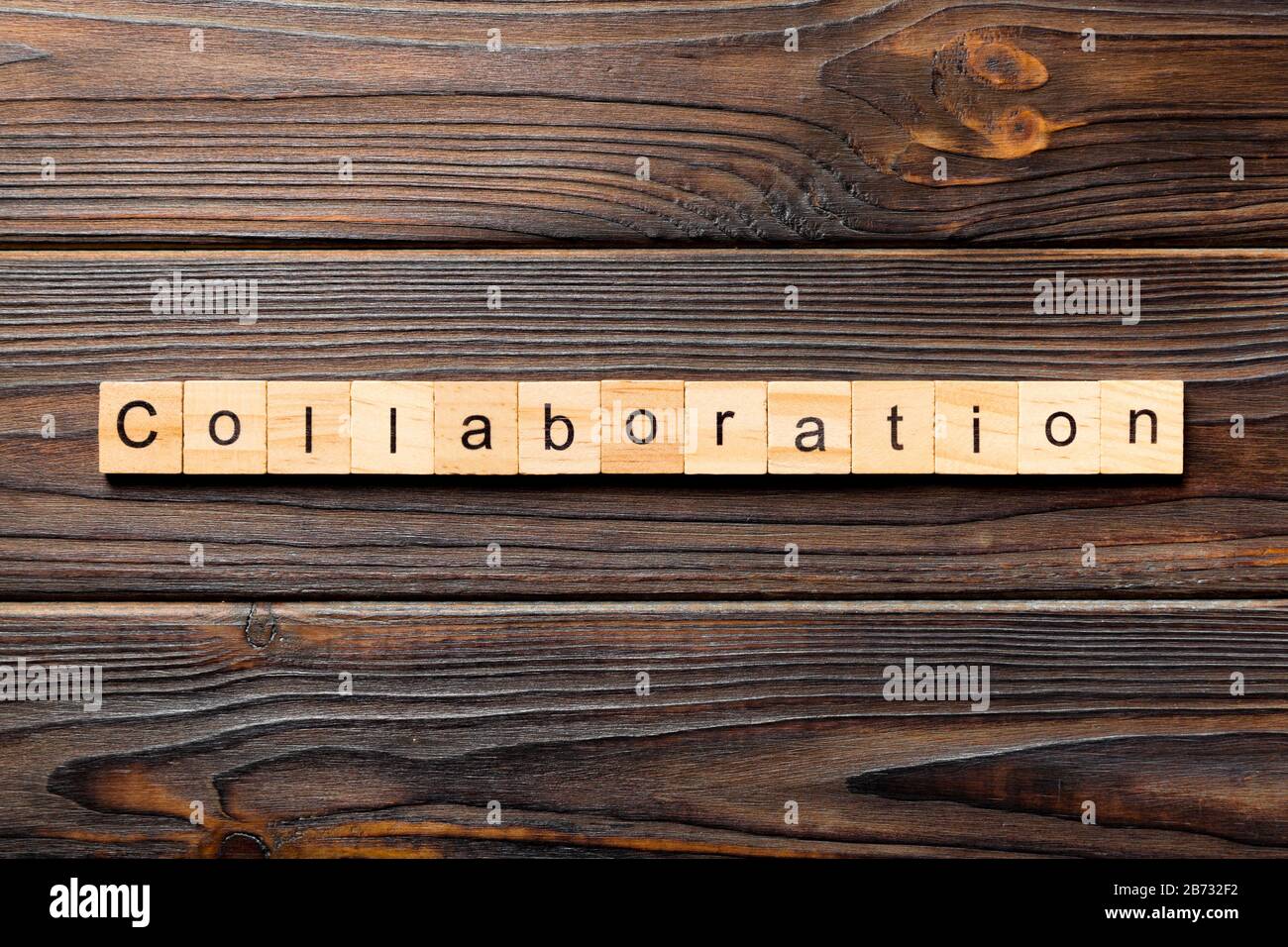 Collaboration word written on wood block. Collaboration text on wooden ...