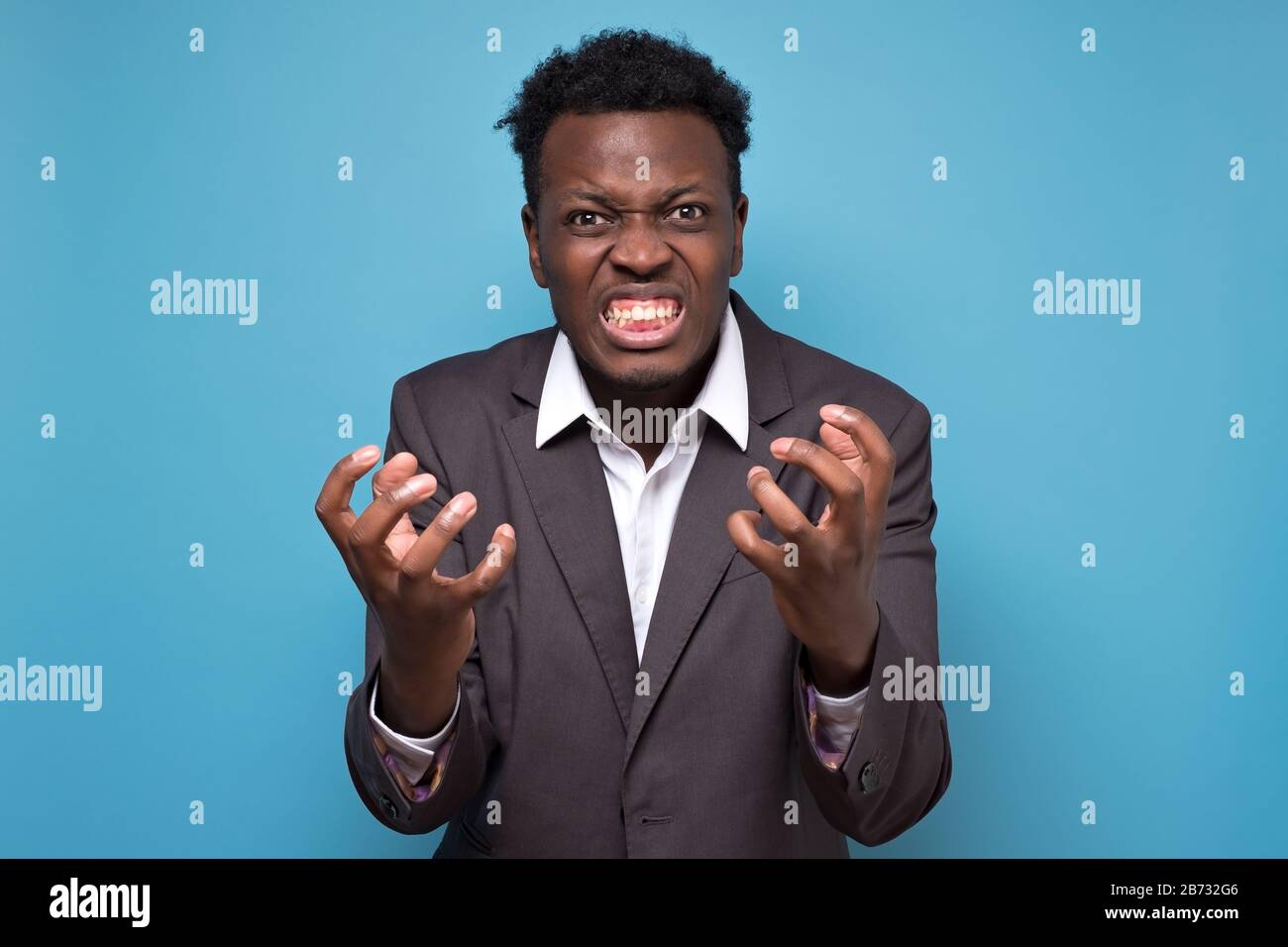 African american funny man in suit being furious and angry clenching ...