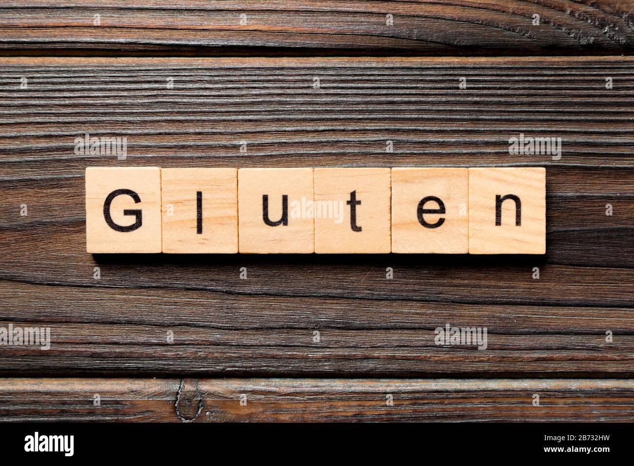 gluten word written on wood block. gluten text on table, concept Stock ...