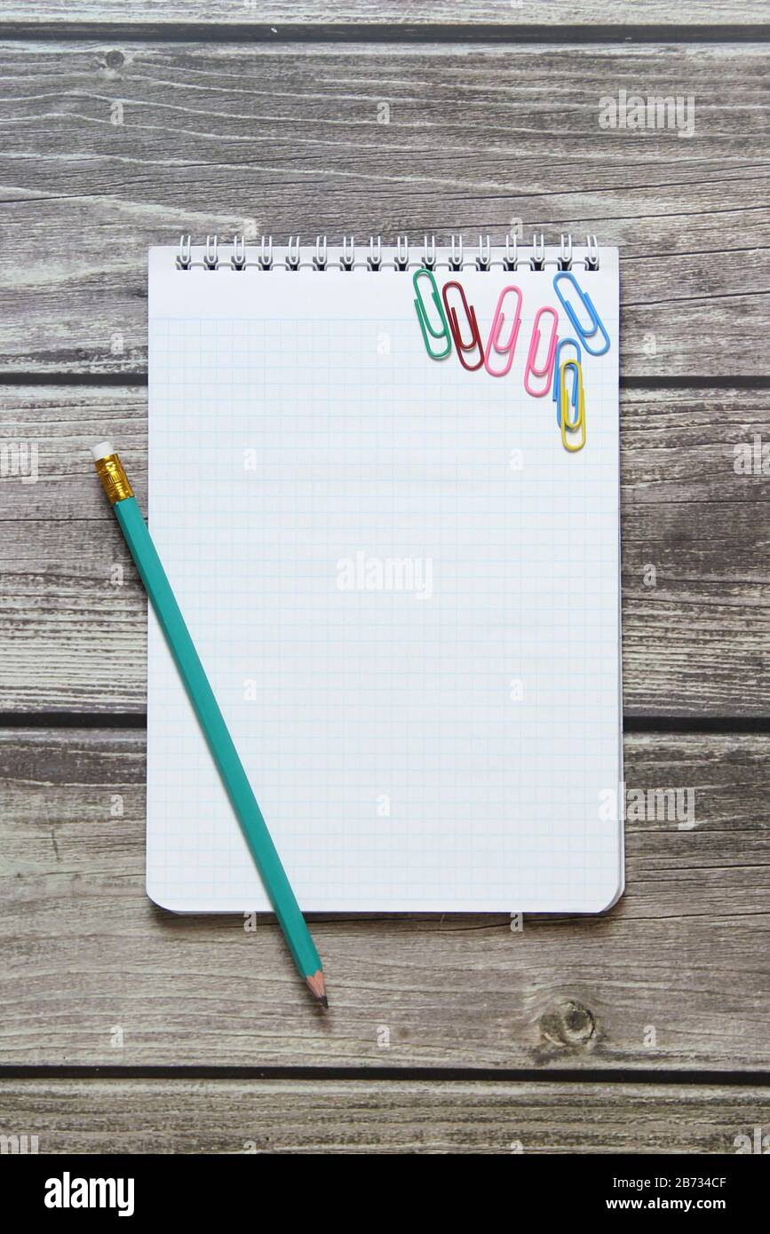 Notepad with a blank white sheet in a checker paper with simple ...